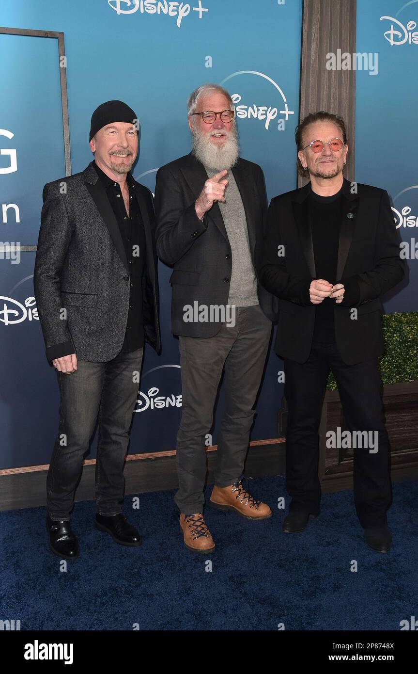 The Edge,from left, David Letterman and Bono arrive at the premiere of ...