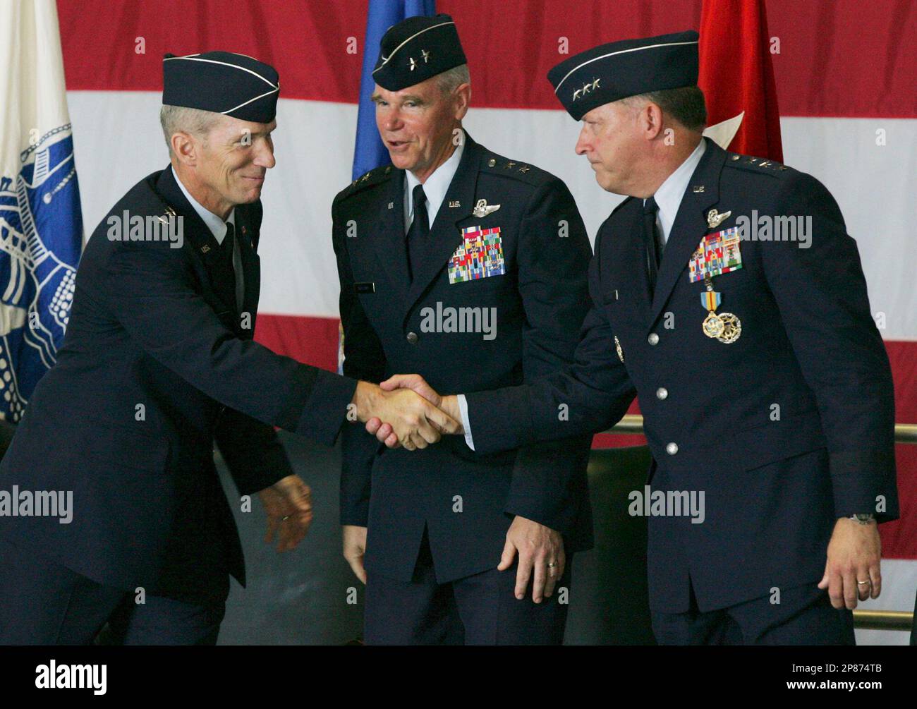 Outgoing commander, Lt. Gen, Gary L. North, right, shakes hands with ...