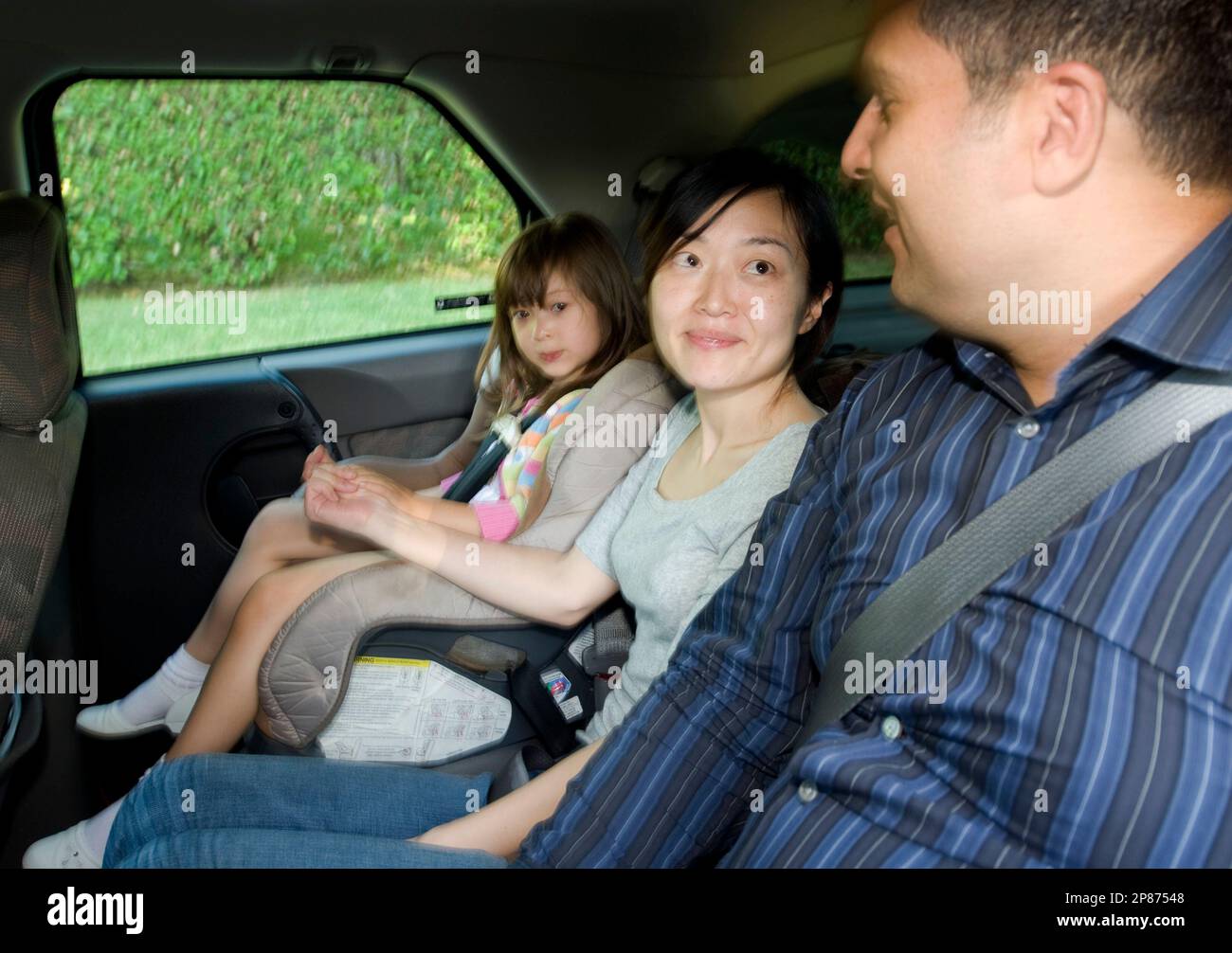 Freed journalist Euna Lee, center, husband Michael Saldate and daughter Hana Saldate wait to be ...