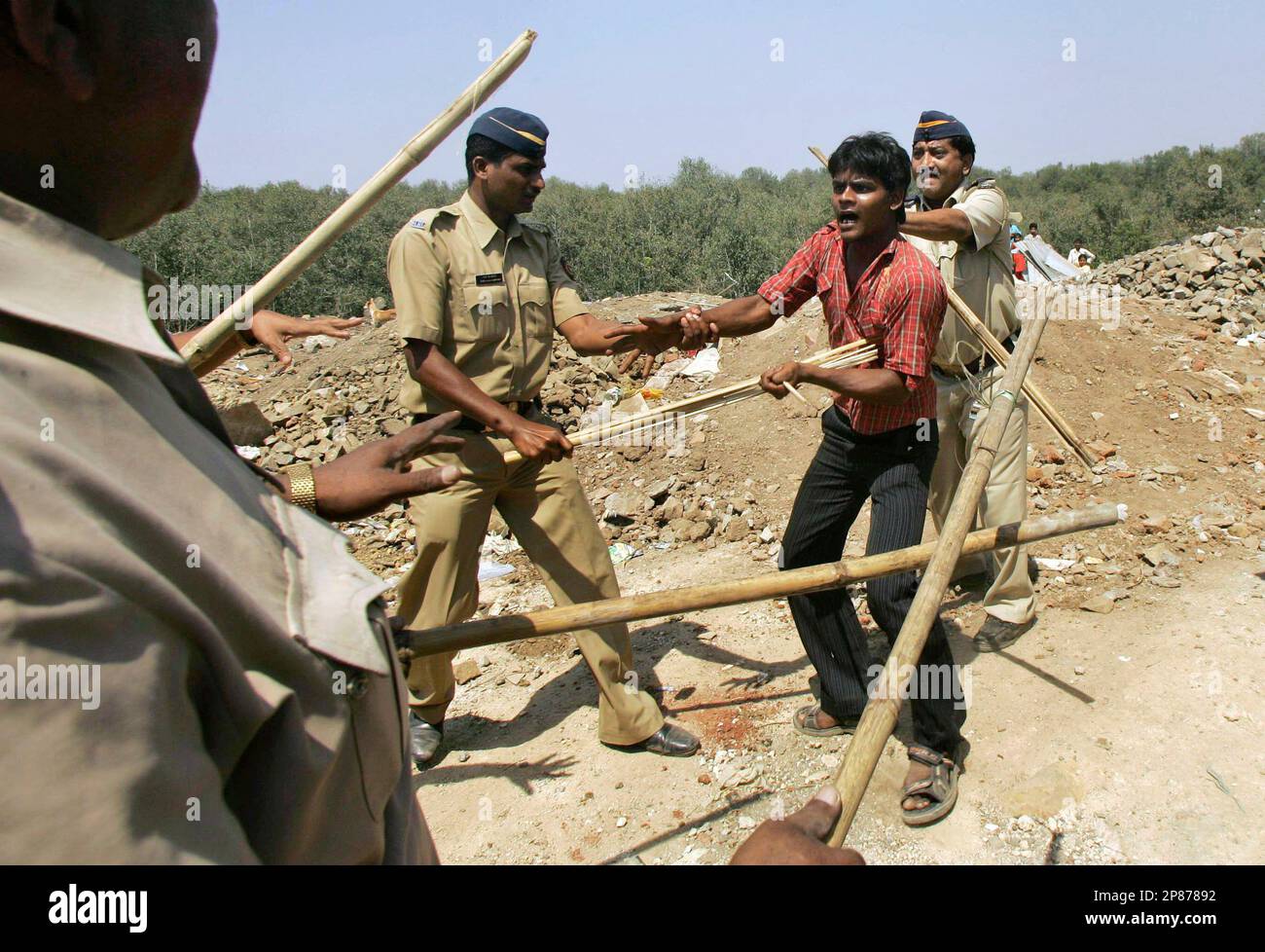 FILE- In this March 4, 2009 file photo, police officers beat a ...