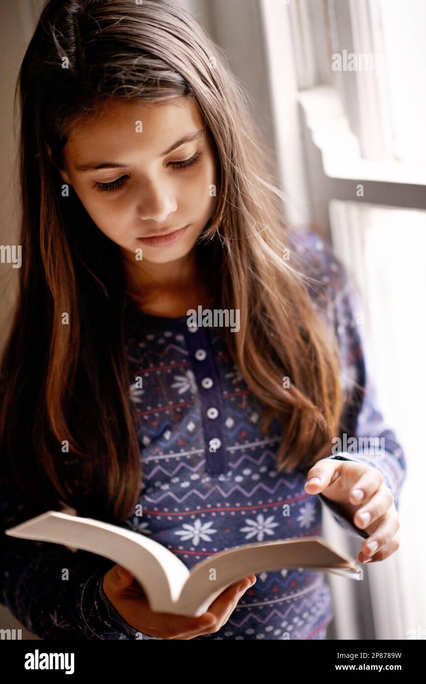 Today a reader tomorrow a leader. Portrait of a cute little girl ...