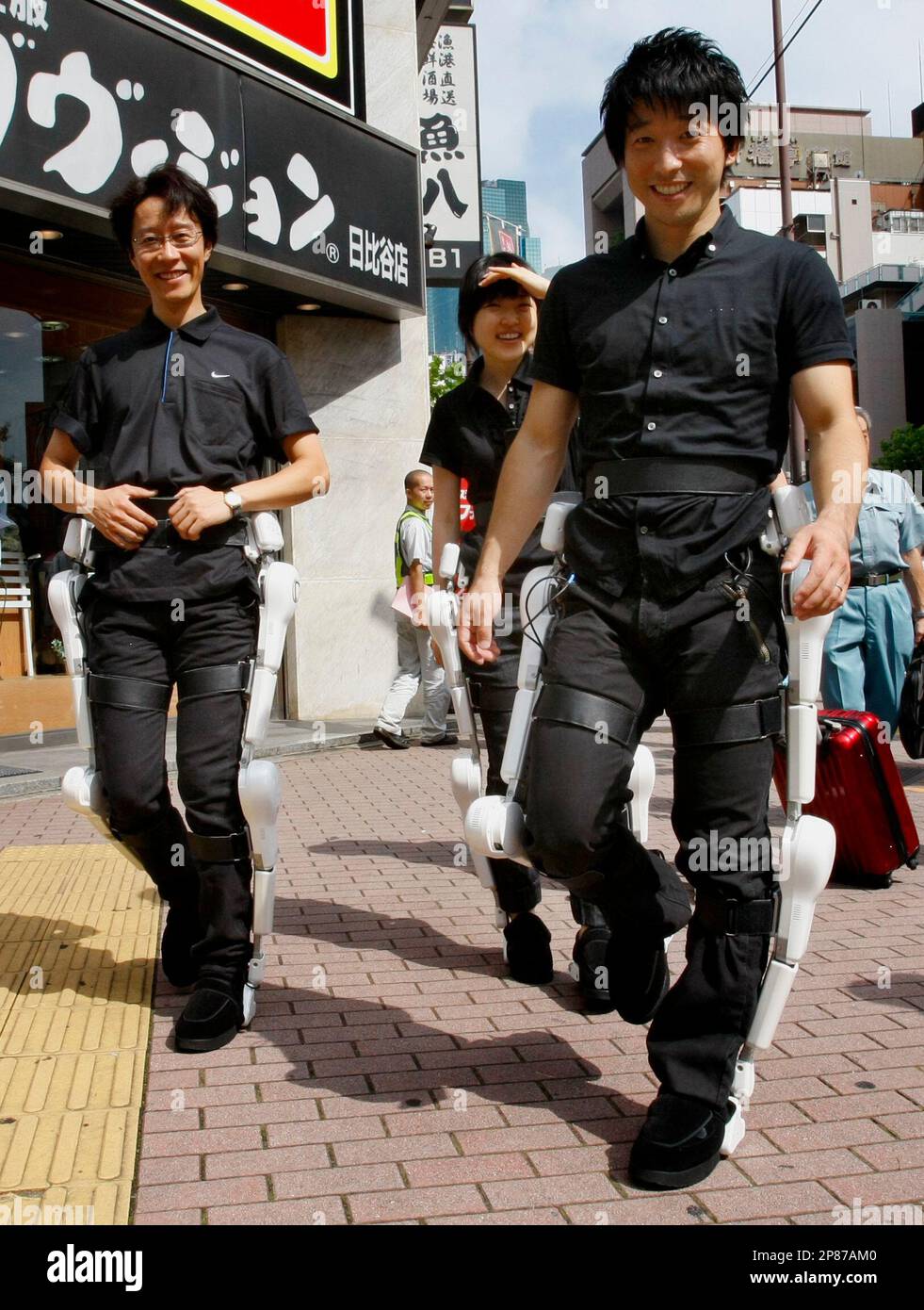 Cyberdyne Inc. employees, from left, Masatoshi Kameoka, Fumi Takeuchi ...