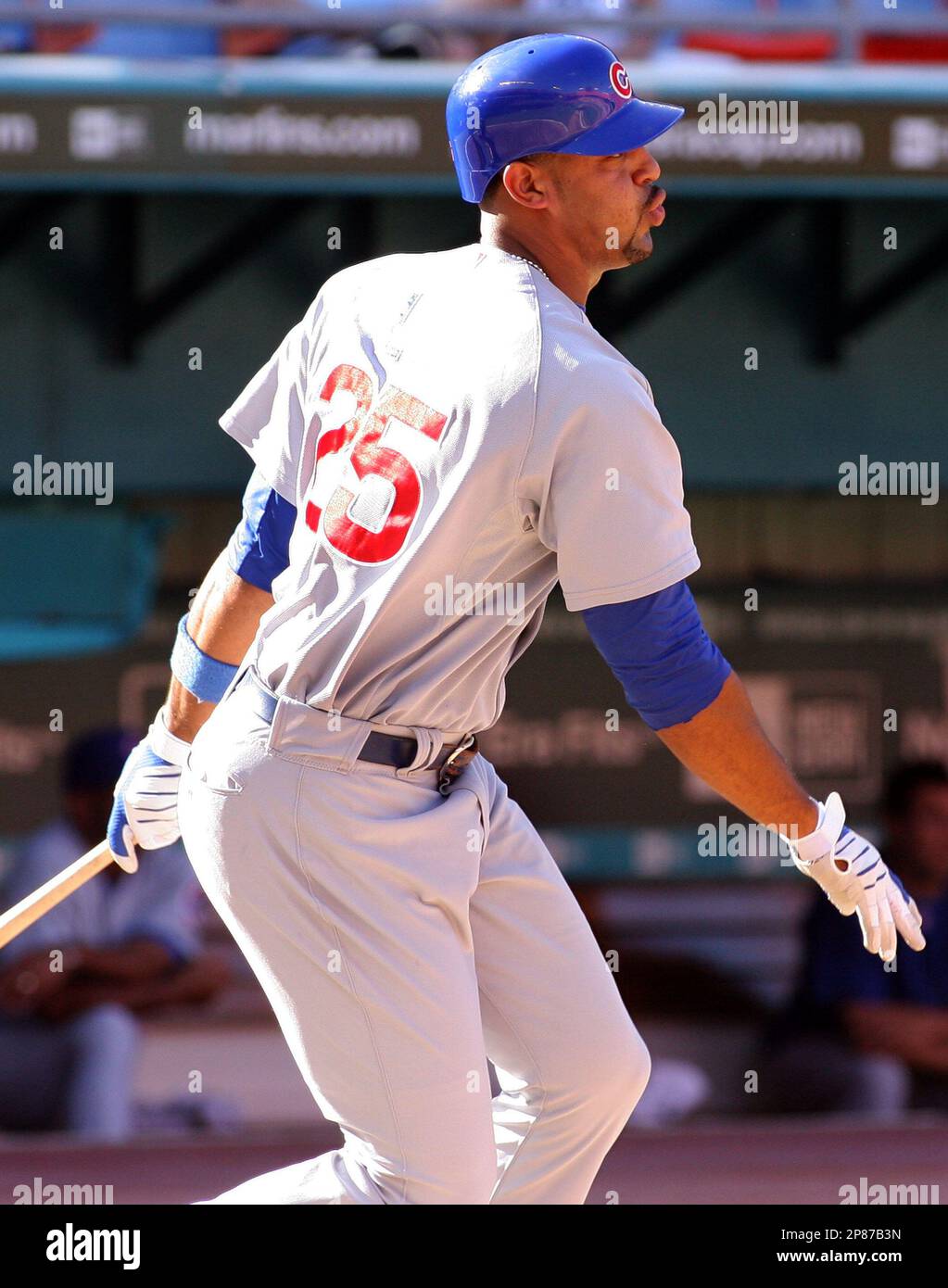 Chicago Cubs' Derreck Lee hits a single, scoring teammate Sam Fuld ...