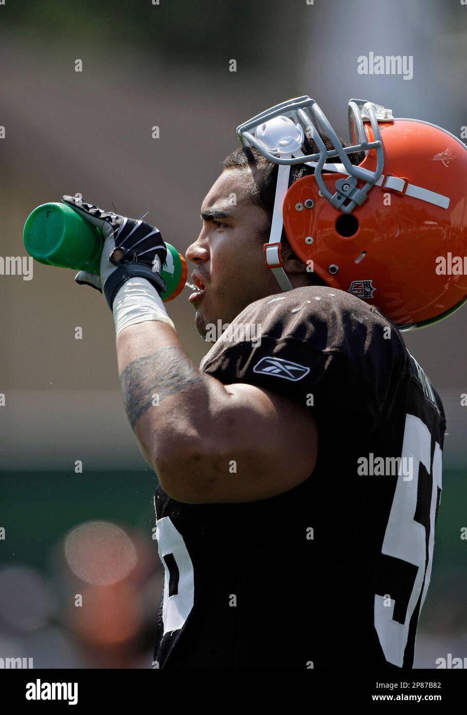 Cleveland Browns linebacker Kaluka Maiava takes a drink during practice ...