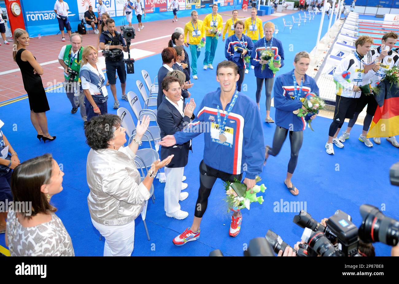 Michael Phelps of the United States is greeted by his mother Debbie ...