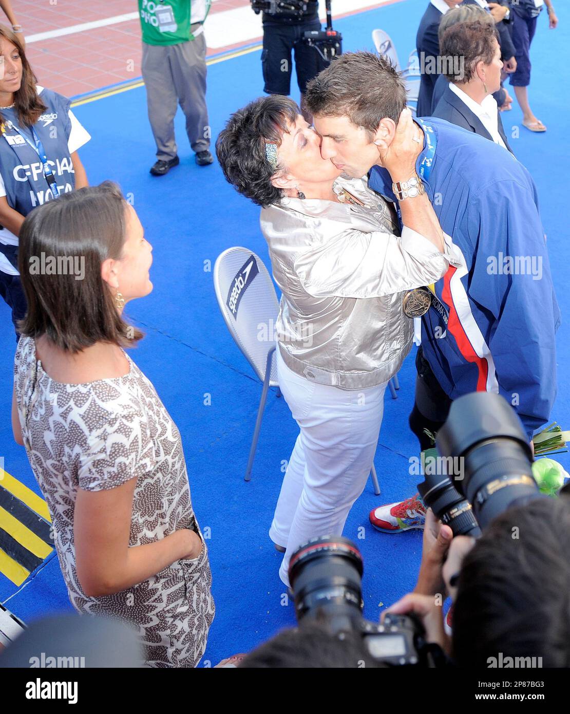 Michael Phelps of the United States is greeted by his mother Debbie ...