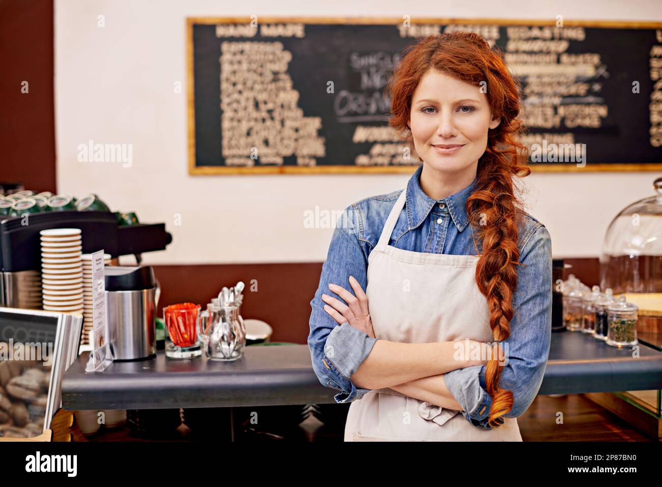 Making the best coffee is my business. Portrait of an attractive ...