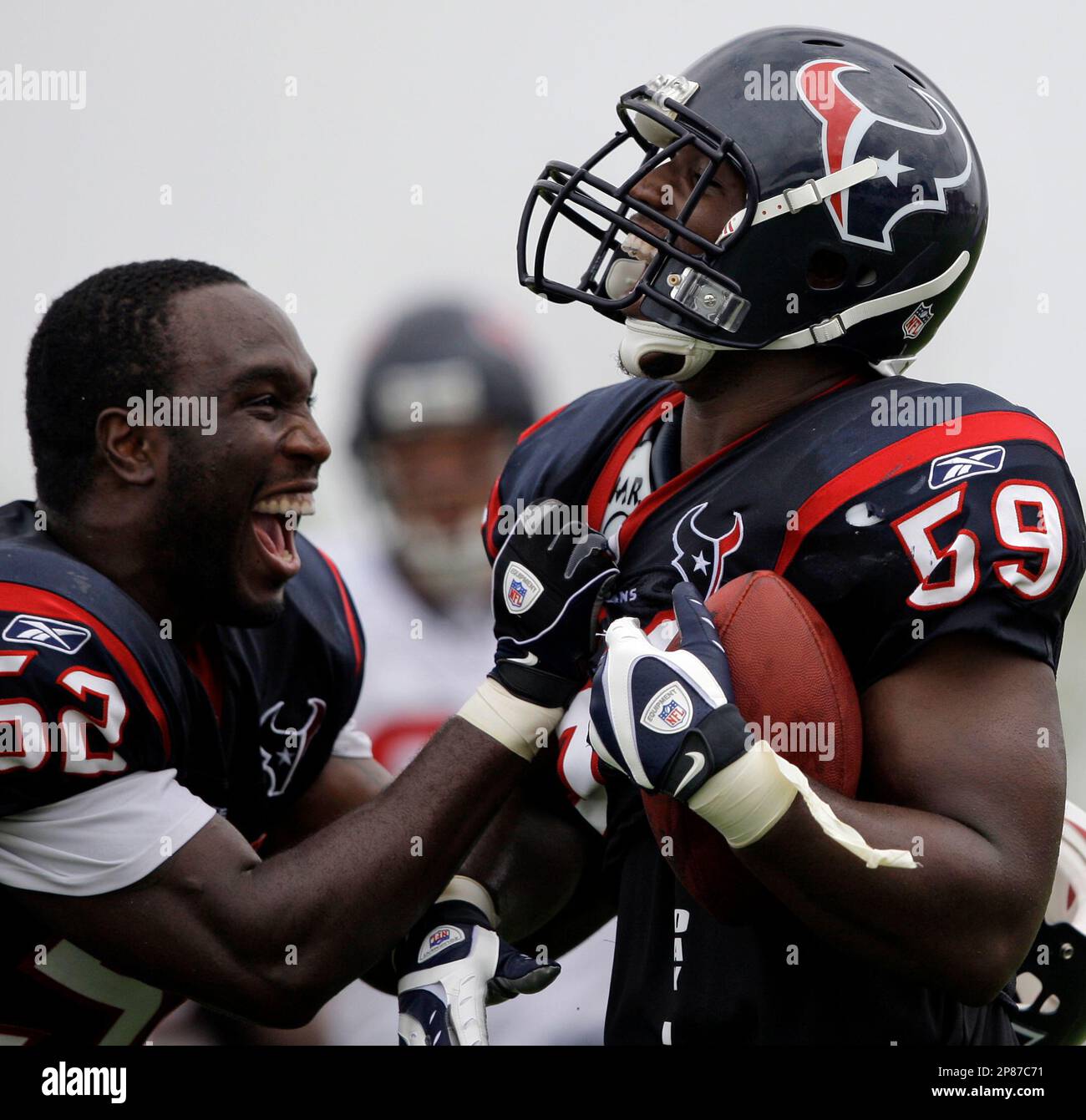 Houston Texans linebacker Xavier Adibi, left, celebrates linebacker ...
