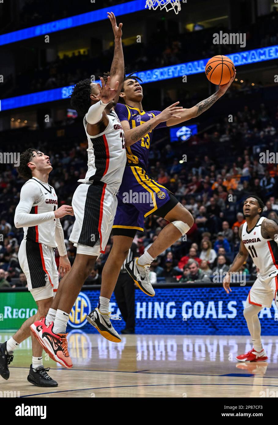 NASHVILLE, TN - MARCH 08: LSU Tigers forward Jalen Reed (13) drives to ...
