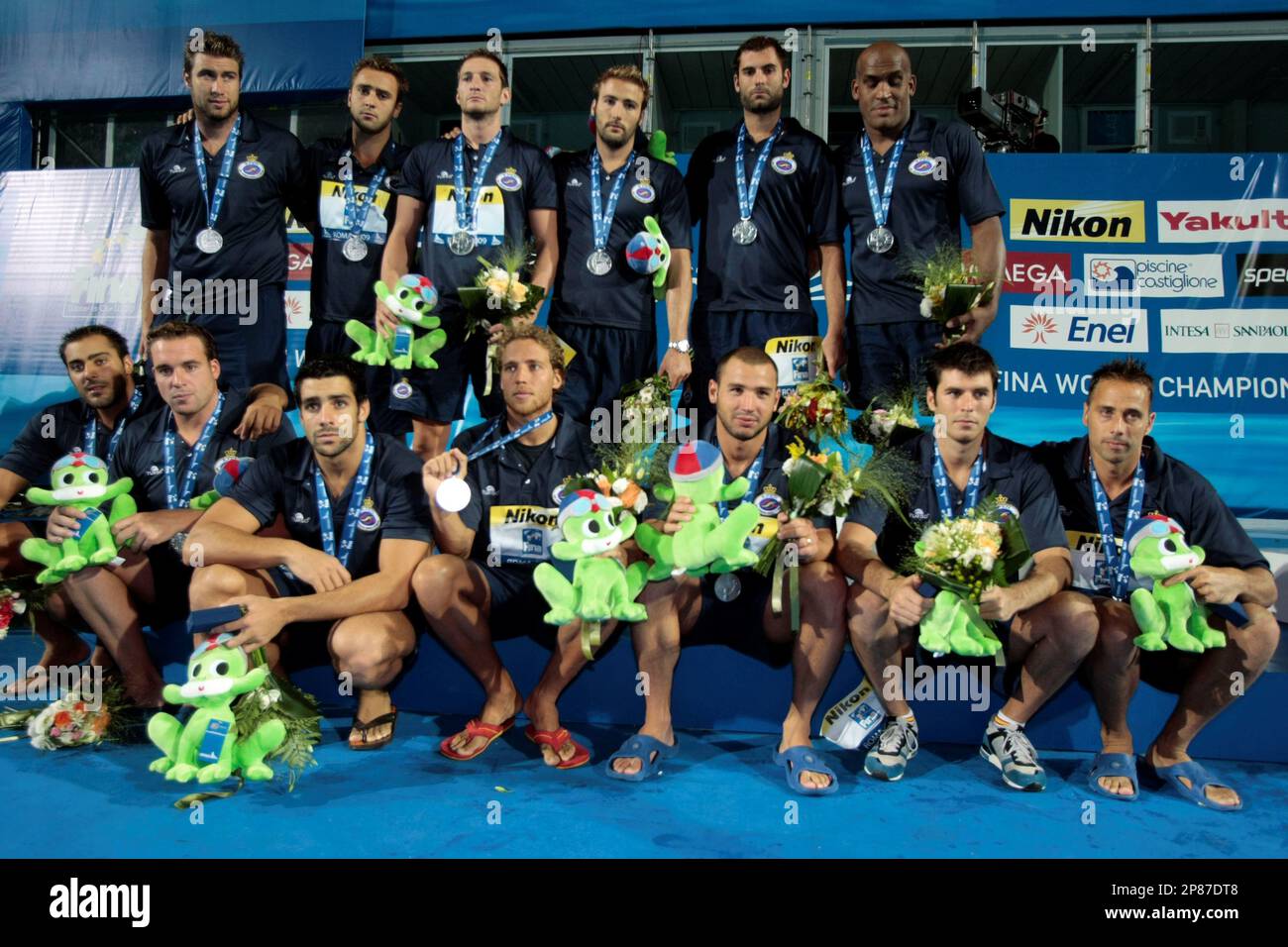 The Spanish team pose with their silver medals of the Men's Water polo ...