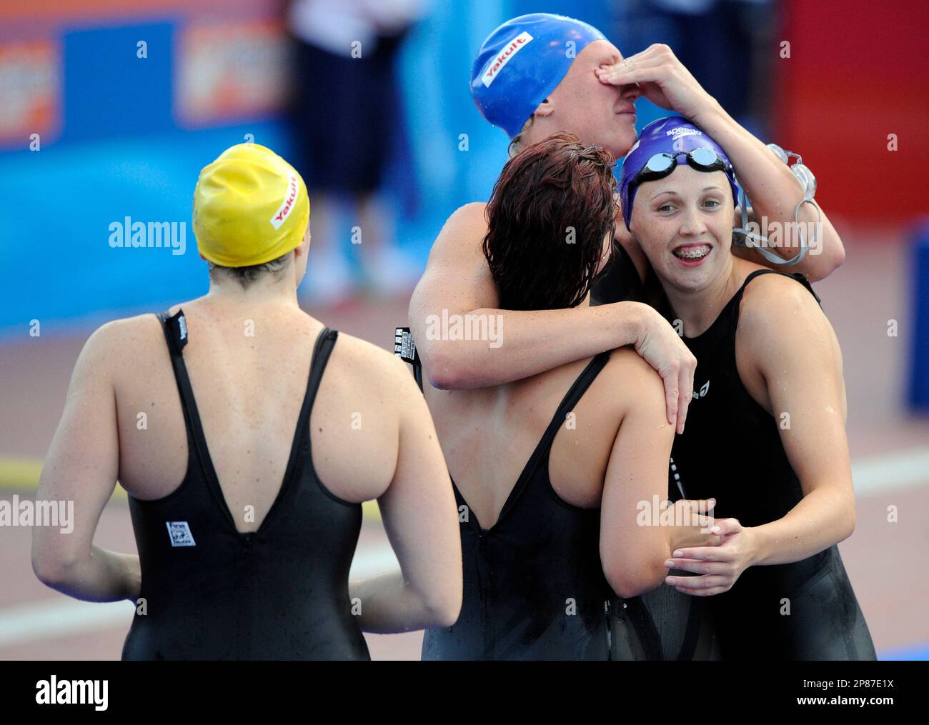 Britain's Gemma Spofforth, center, reacts after finishing fourth in the ...