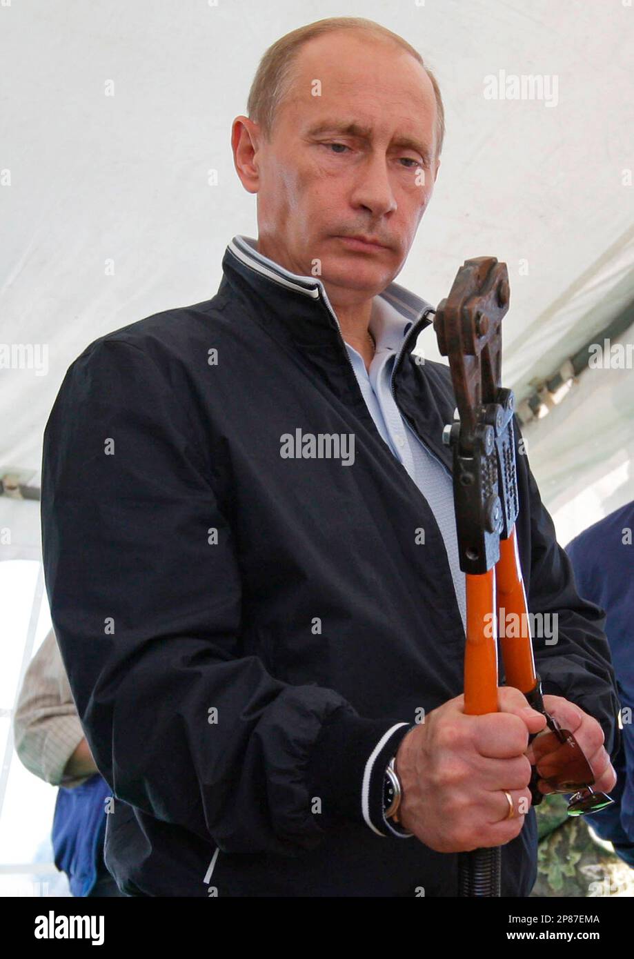 Russian Prime Minister Vladimir Putin looks at a tagging tool as he ...