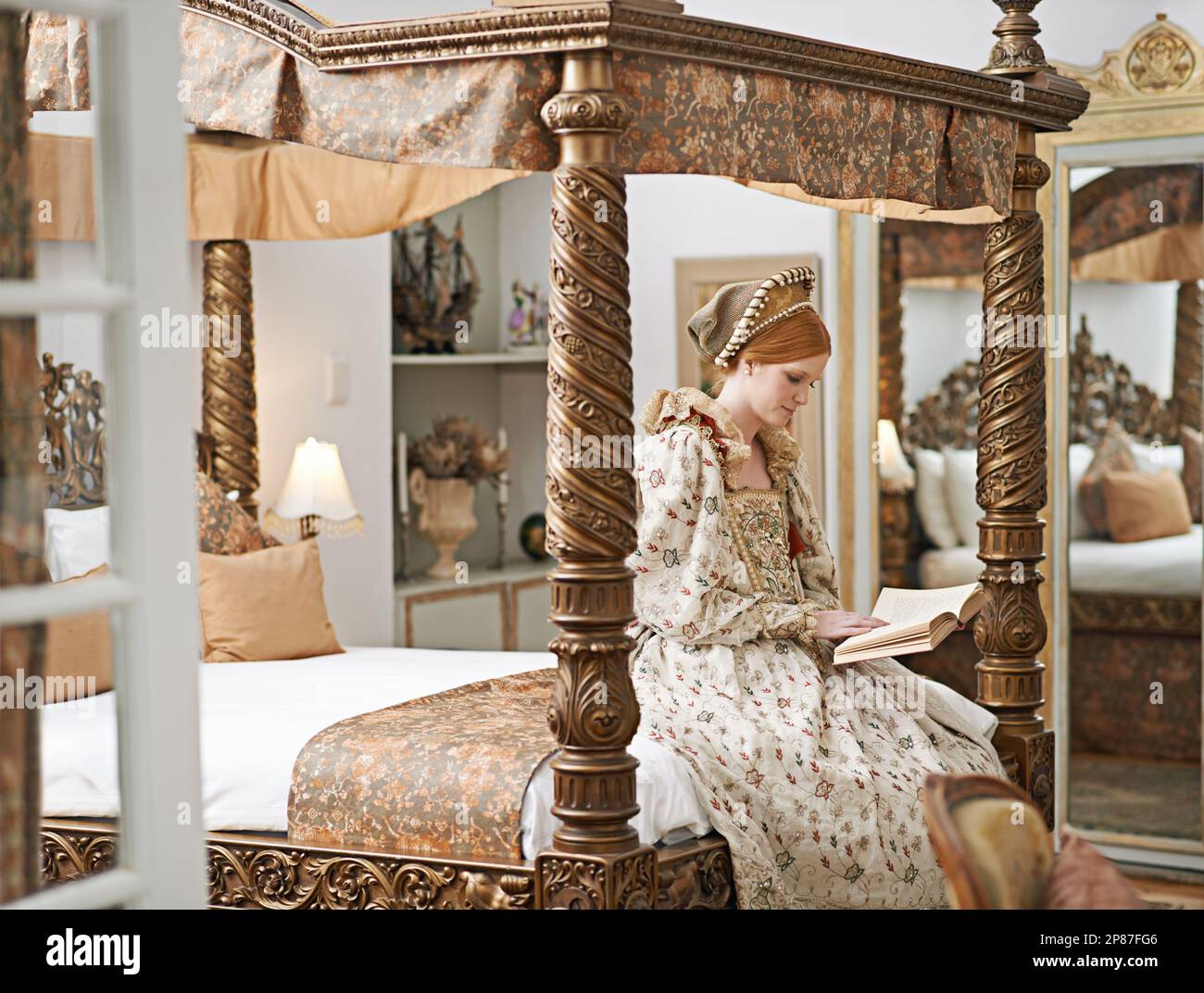 Bedchamber solitude. an elegant noble woman reading in her palace room ...