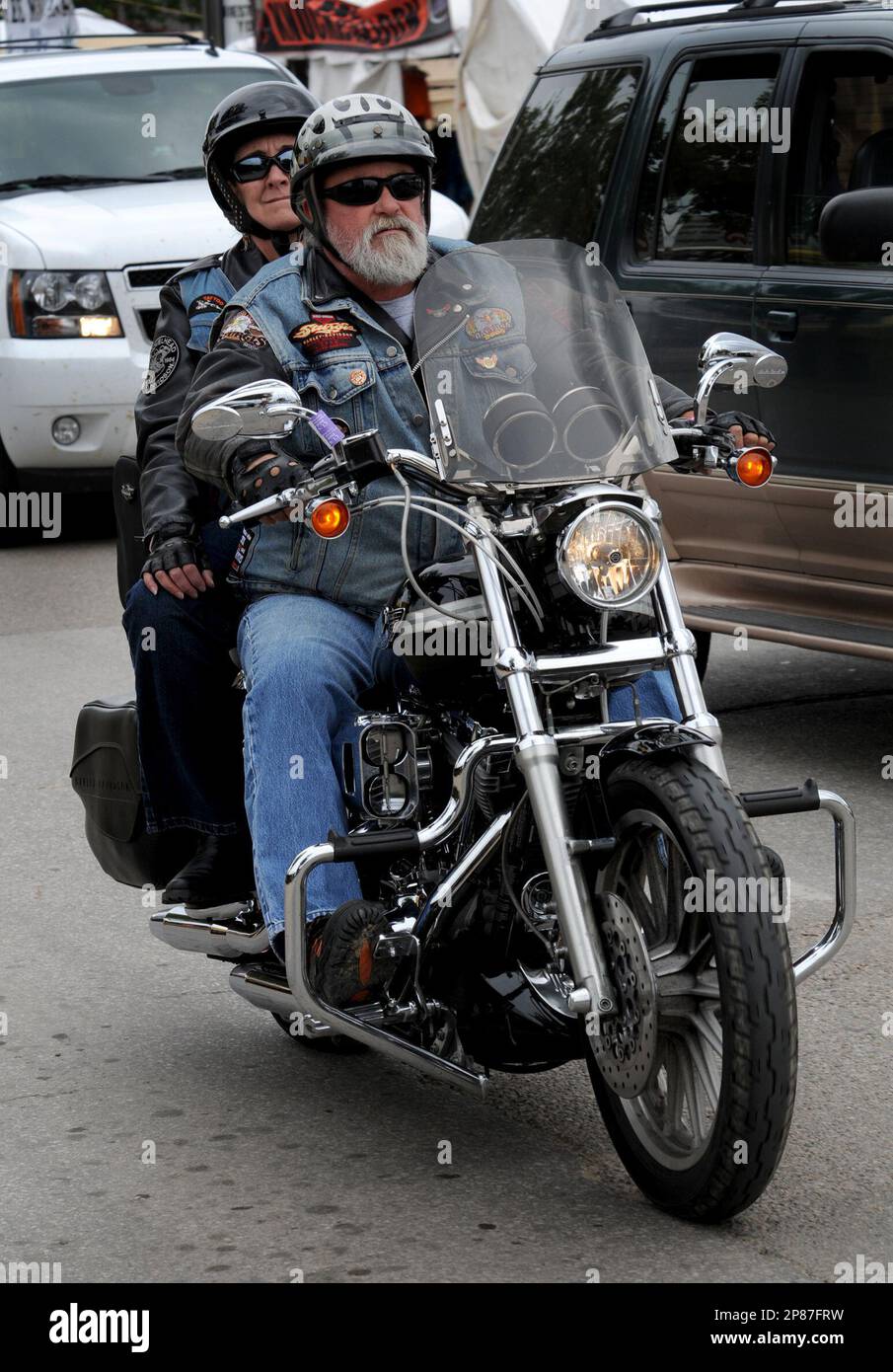 J.W. Flannery, 54, and his wife Cynthia, 52, both wear helmets and ...