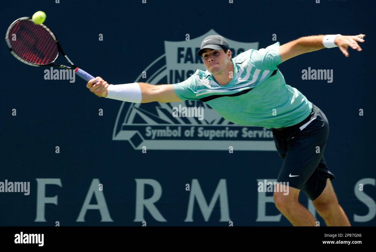 John Isner, of the United States, reaches for a return during a ...