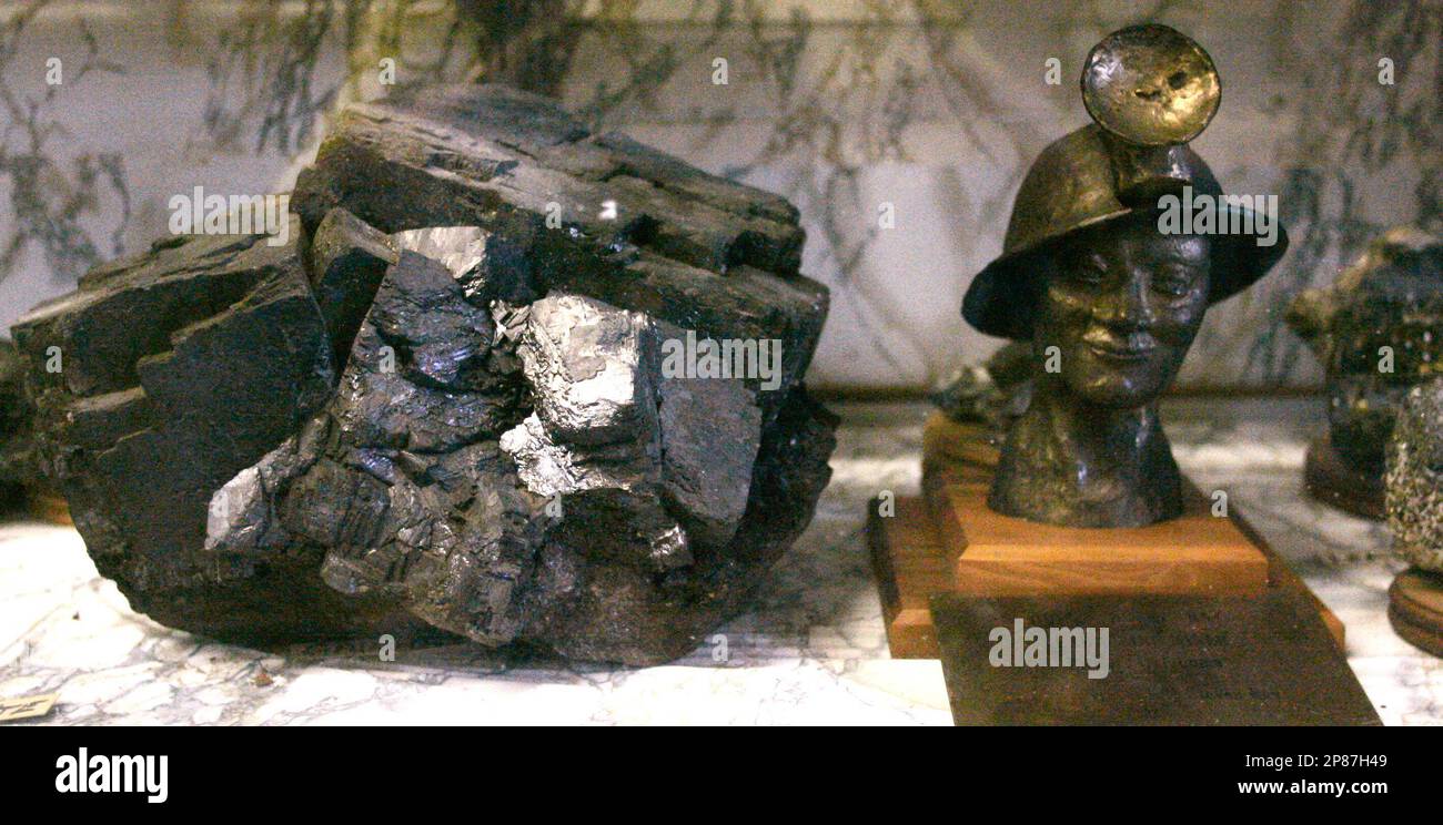 In this photo taken Wednesday, July 8, 2009, a sample of lead and a ...