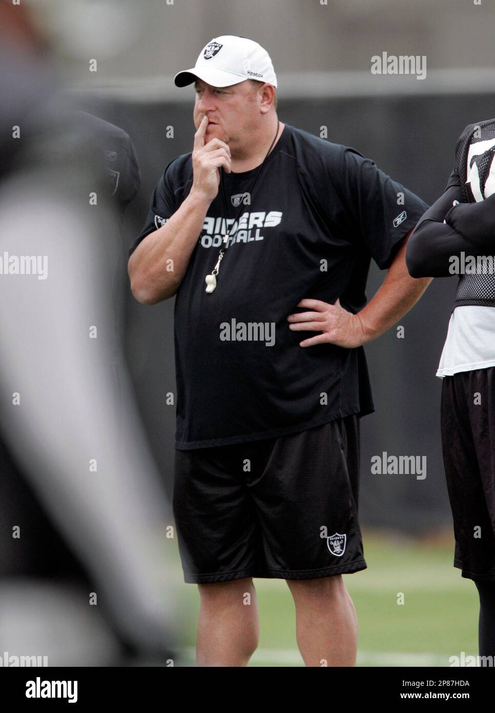 Oakland Raiders head coach Tom Cable watches practice during NFL ...