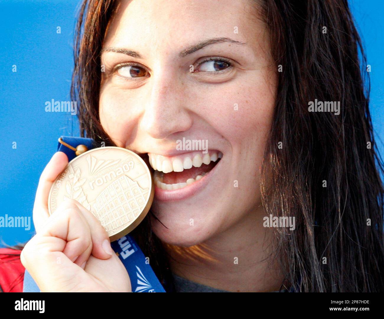 Austria's Mirna Jukic bites the bronze medal of the Women's 200m ...