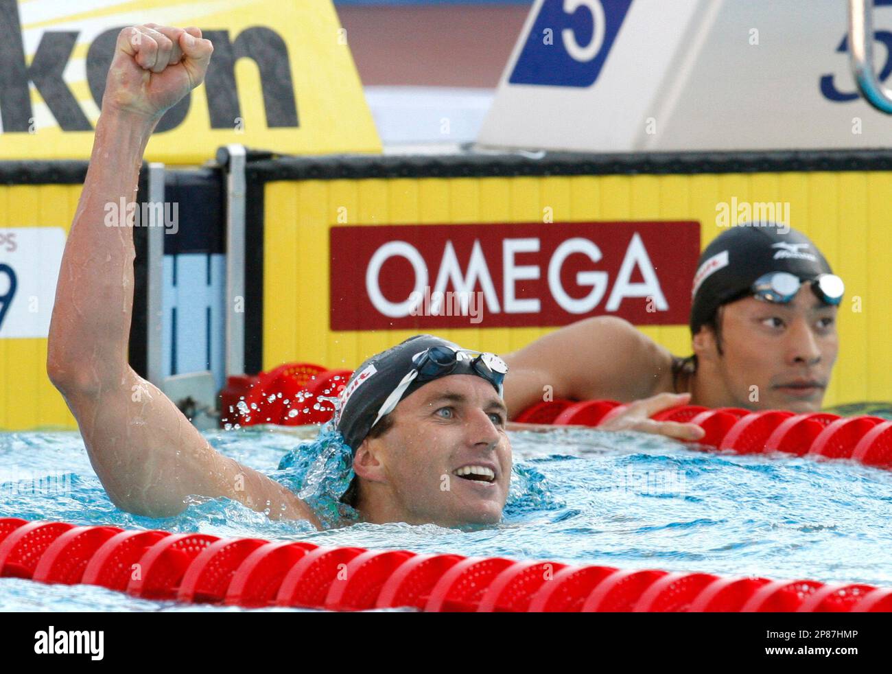 Aaron Peirsol of the United States, left, celebrates alongside silver ...