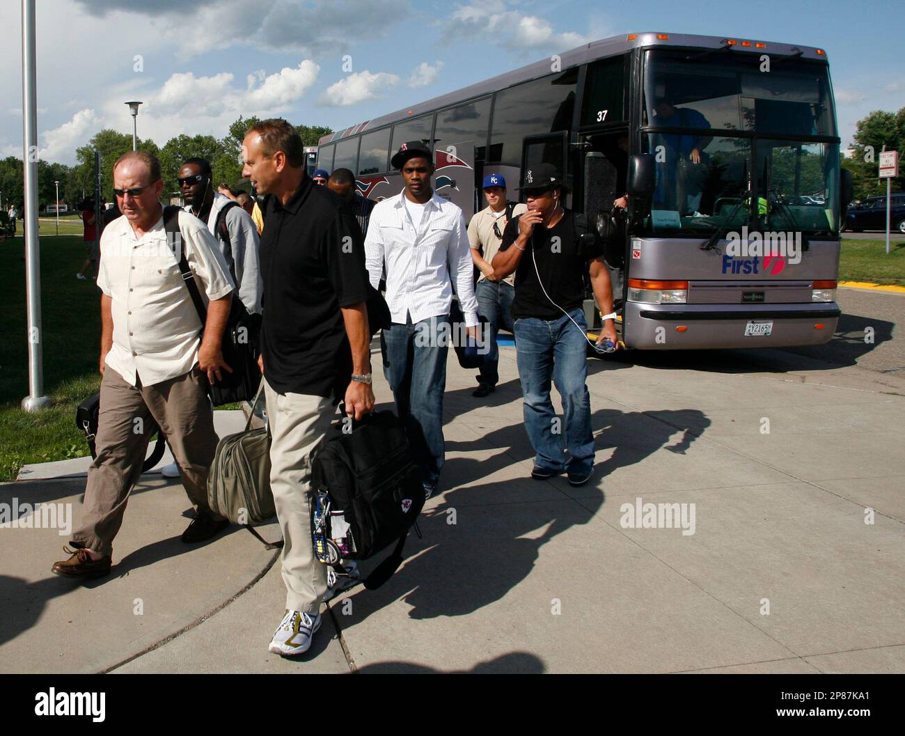 Kansas City Chiefs coaches and players walk from buses as they arrive ...