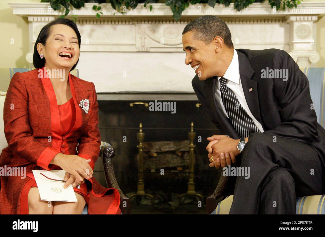 President Barack Obama shares a light moment with Philippine President ...