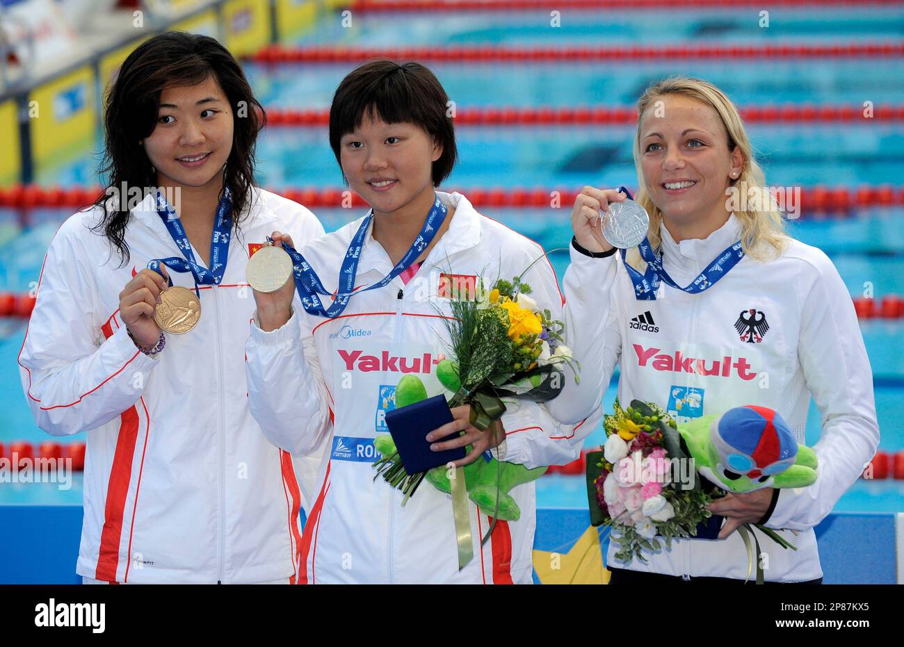 China's Zhao Jing, center, shows the gold medal of the Women's 50m ...