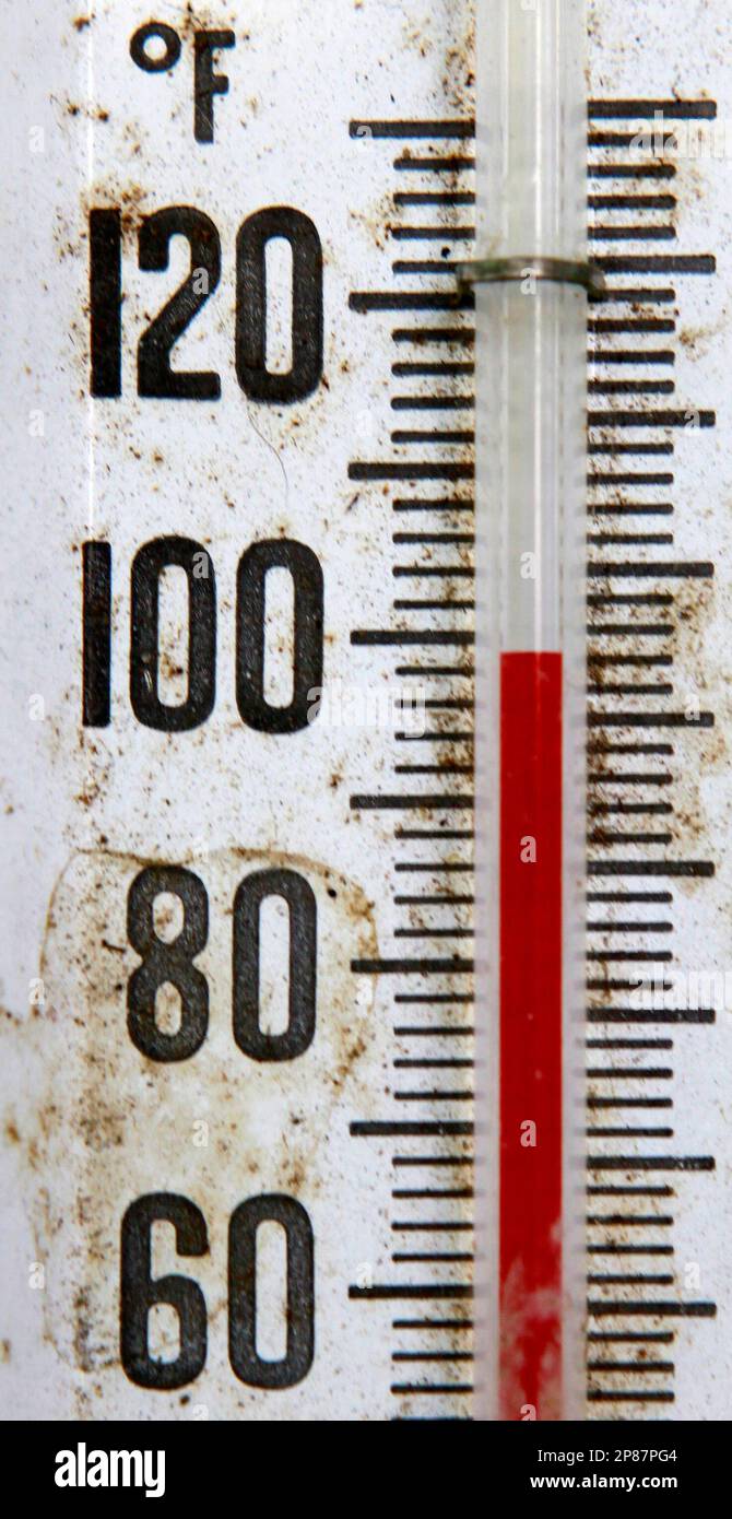A thermometer records just below 100 degrees in a north Seattle ...