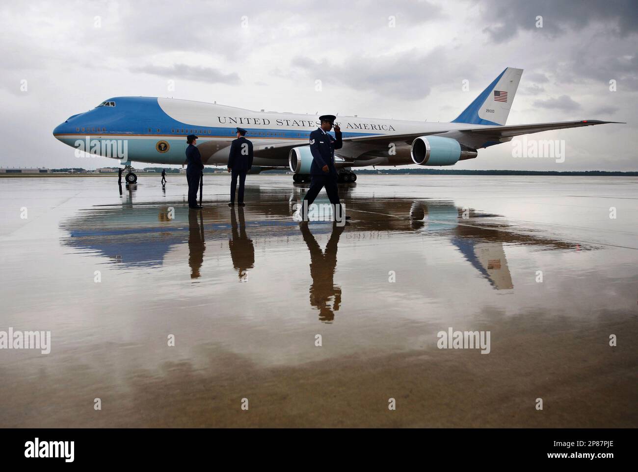 Air Force One, with President Barack Obama aboard, is reflected in the ...