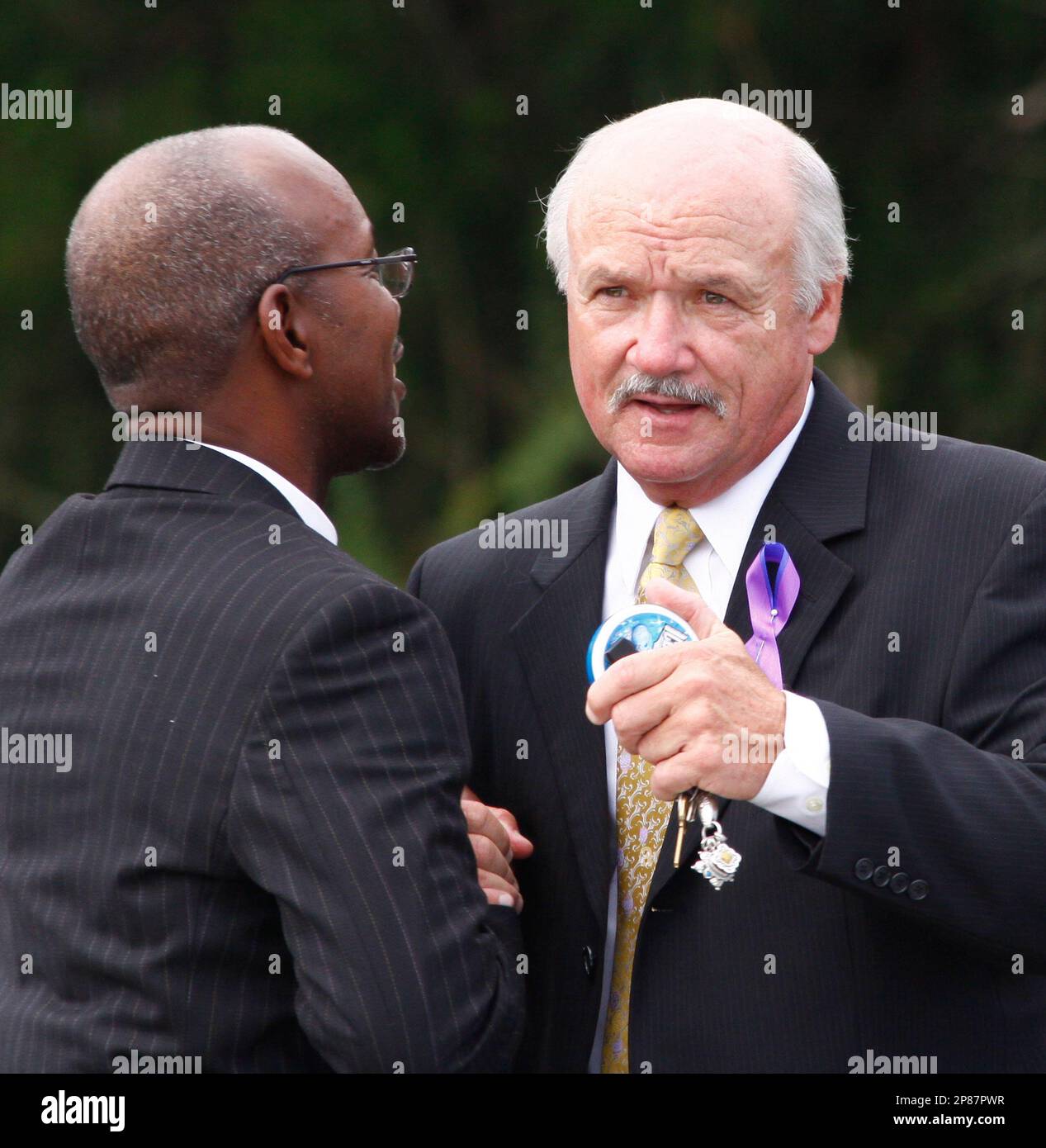 In this July 11, 2009, photo, James "Bus" Cook, right, talks with an ...