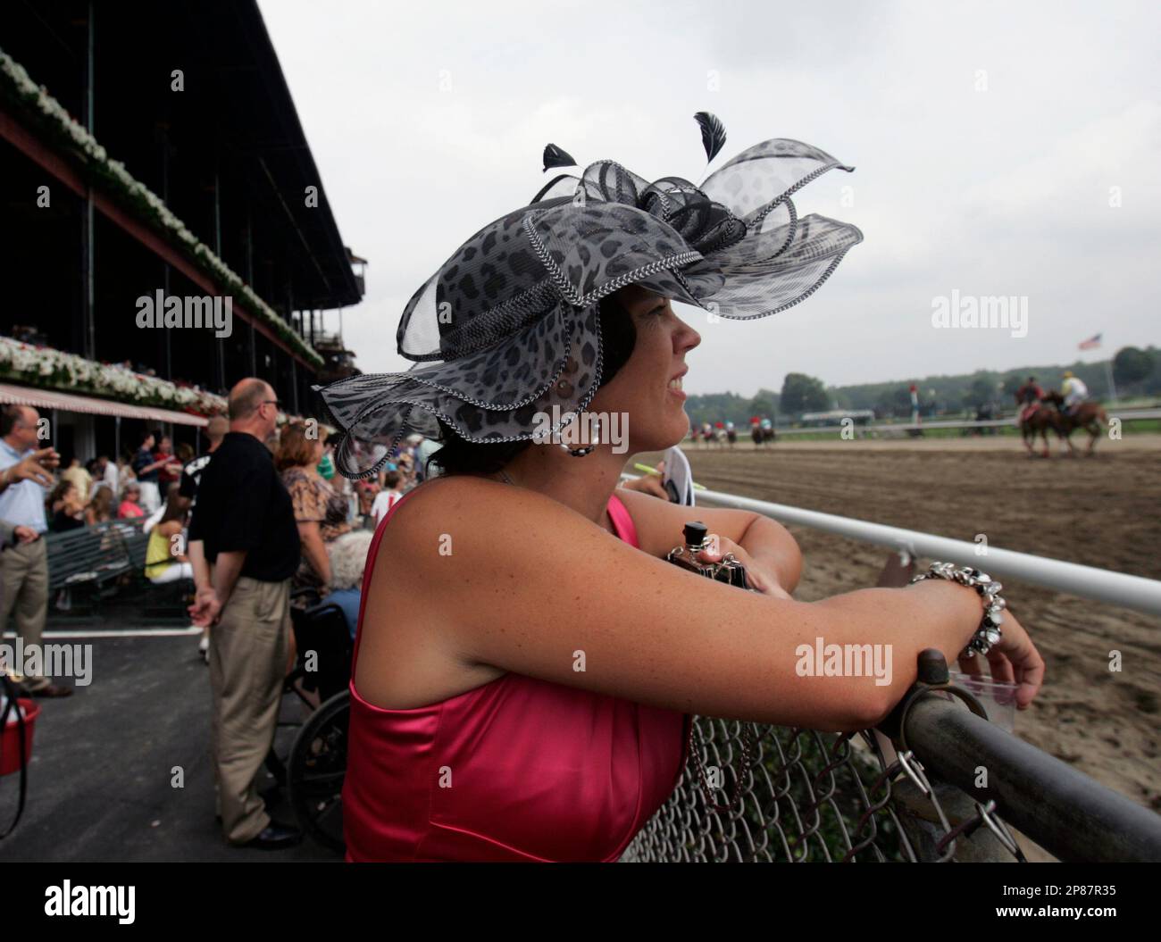 Margaret McCue of Rexford, N.Y., watches the post parade before the ...