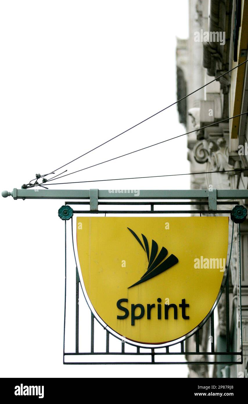 A Sprint sign hangs outside of a Sprint Nextel store in downtown Boston ...