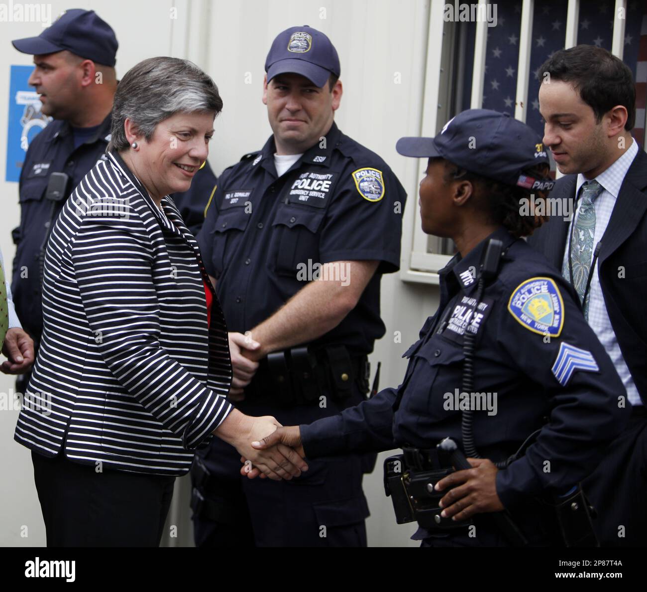 Homeland Security Secretary Janet Napolitano, left, shakes hands with ...