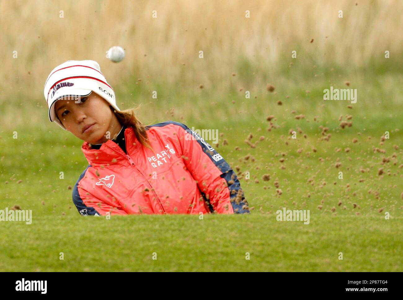 Japan's Momoko Ueda plays out off the bunker on the 14th hole during a ...