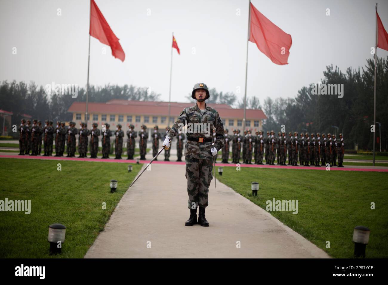 People's Liberation Army soldiers stand in formation during a ceremony ...