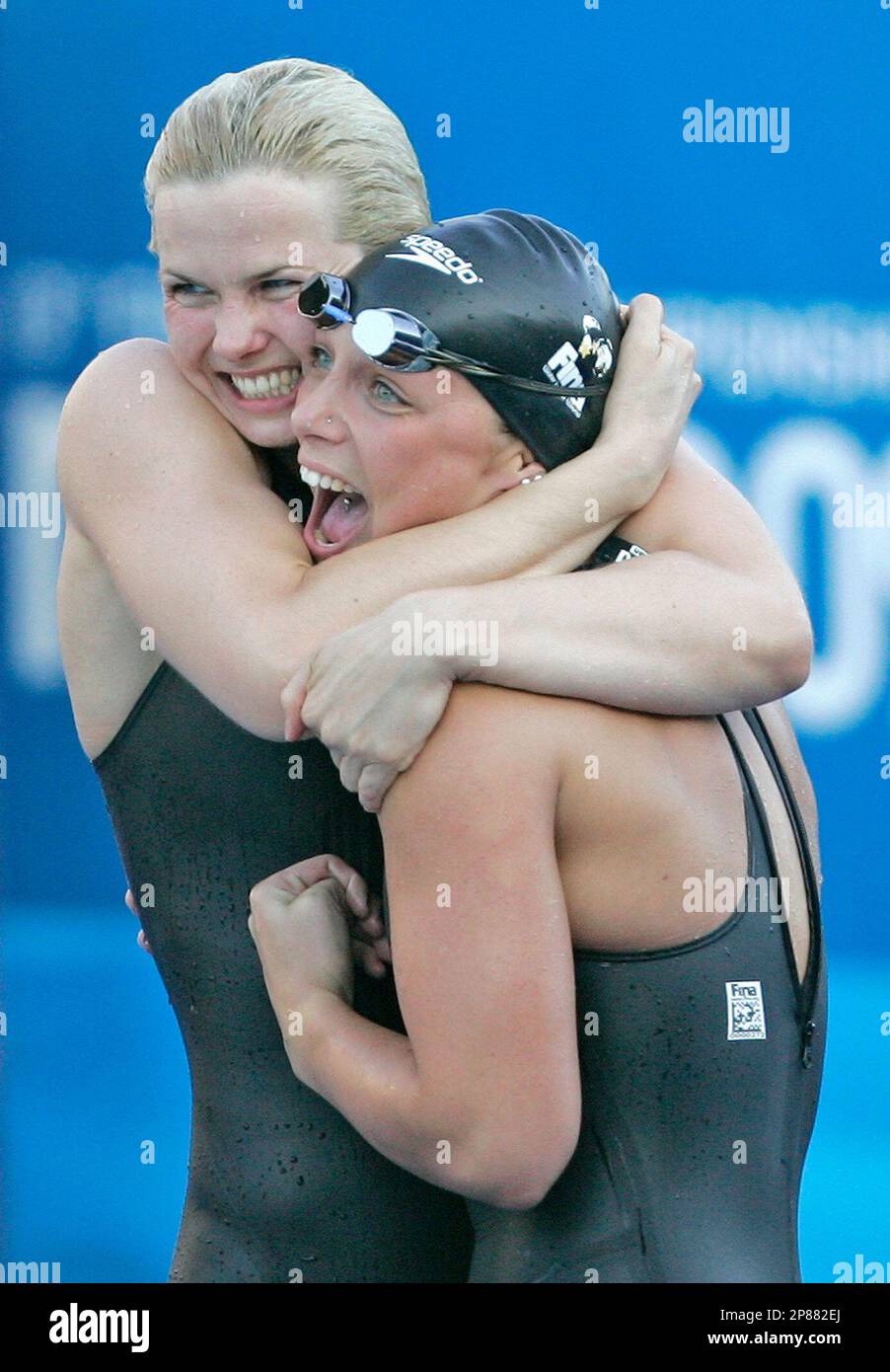 Germany's Britta Steffen, left, and Daniela Samulski react after taking ...