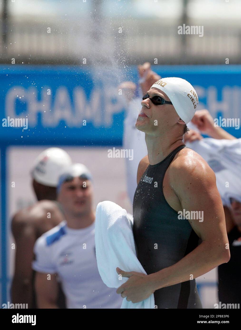 Brazil's Cesar Cielo Filho spits out water before a Men's 4x100M relay ...