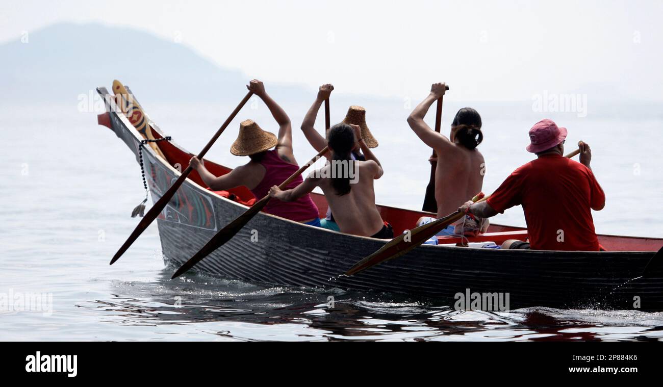 Squamish canoeists pull from a beach at Tsawwassen, B.C. The canoes are ...
