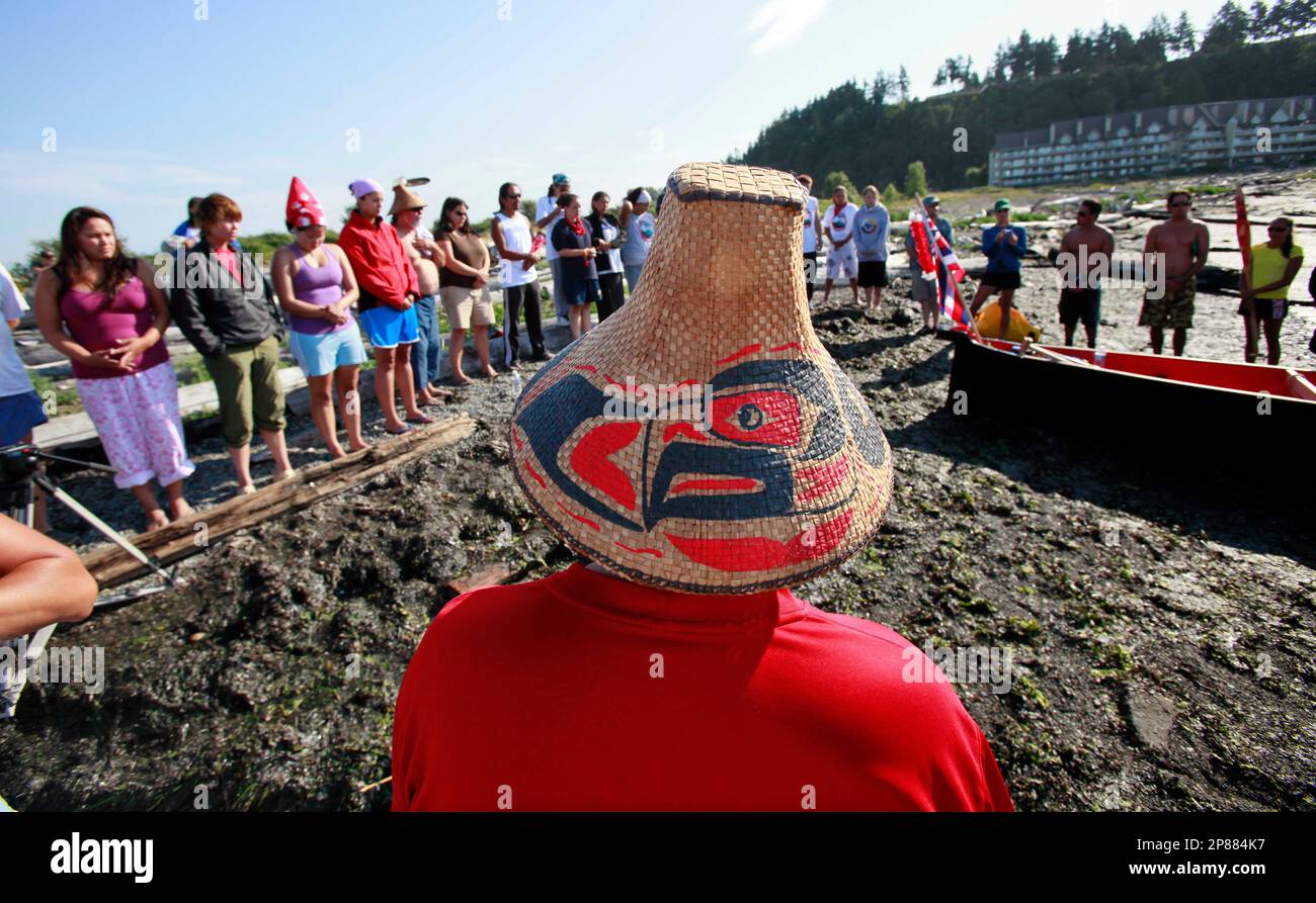 Squamish member Dennis Joseph wears a traditional woven cedar hat as he ...
