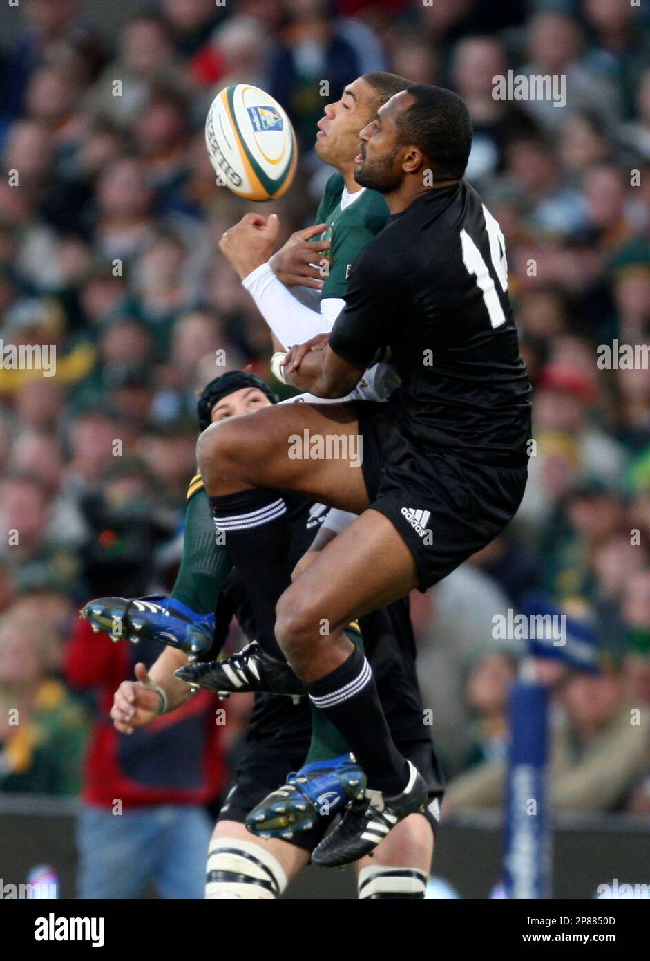 New Zealand All Blacks Joe Rokocoko, right, jumps for the ball against ...