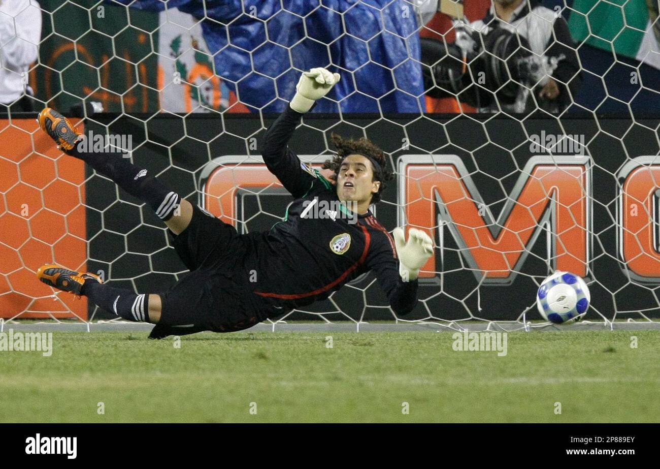 Mexico's goalkeeper Guillermo Ochoa blocks Costa Rica's Froylan Ledezma ...