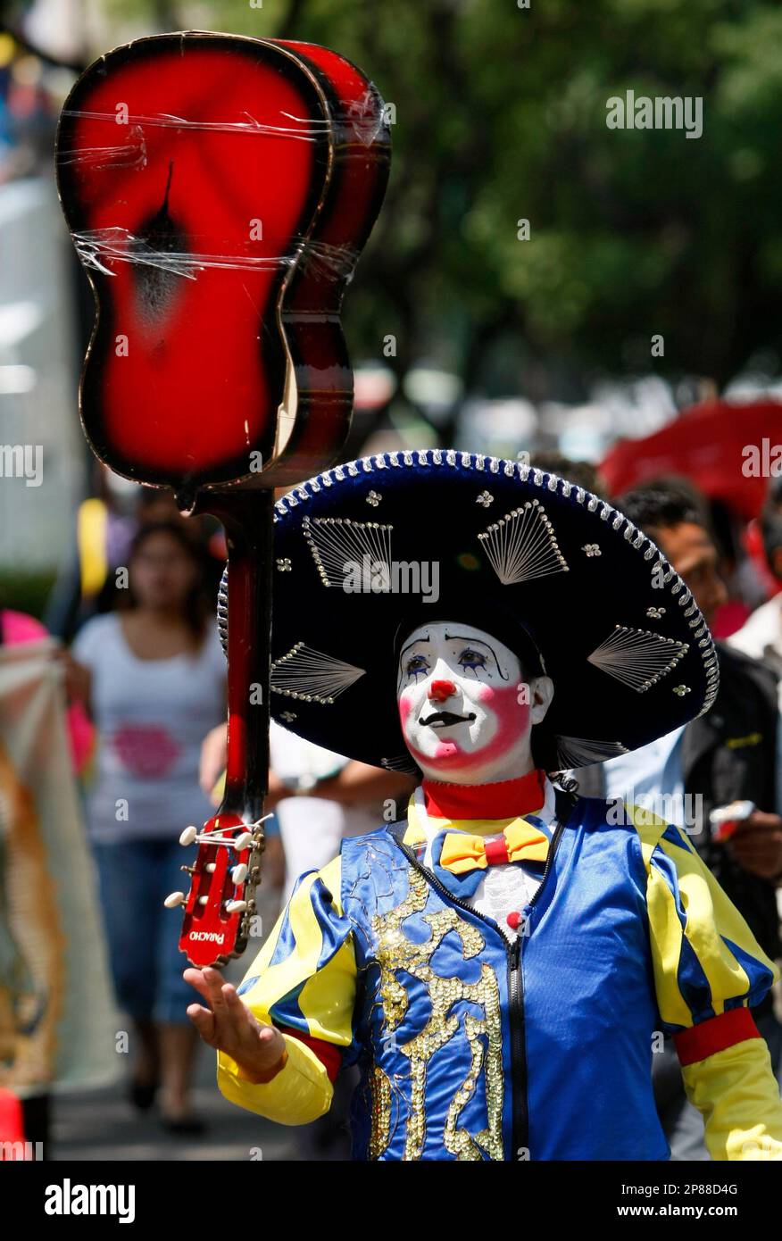 A clown juggles outside the Basilica of Guadalupe in Mexico City ...