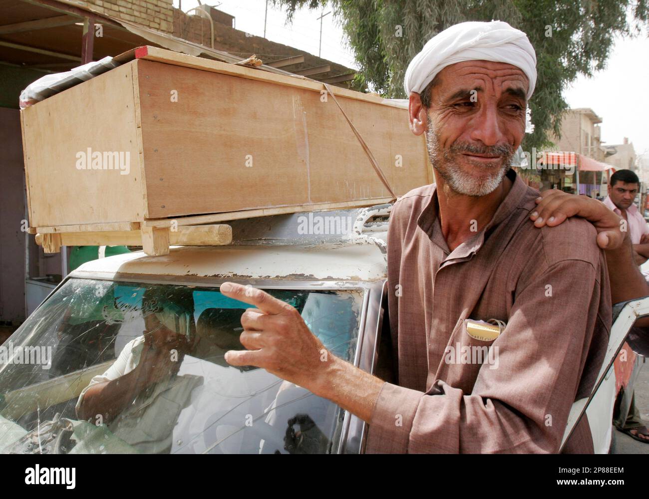 Jabbar Jassim is seen after retrieving the body of his son, Hisham ...