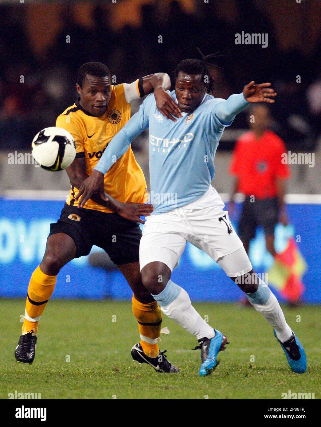 Manchester City player Benjani Mwaruwari, right, vies for the ball with ...