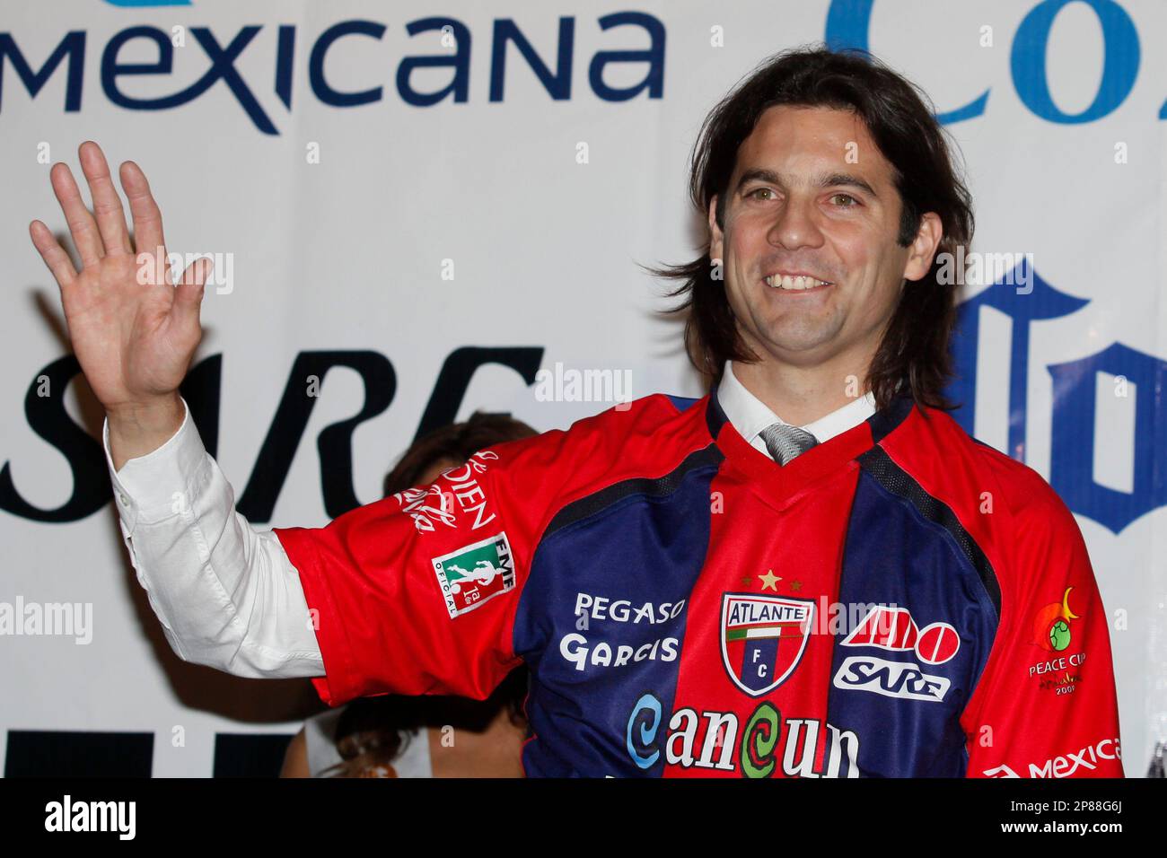 Argentinean soccer player Santiago Solari waves as he wears a jersey of ...