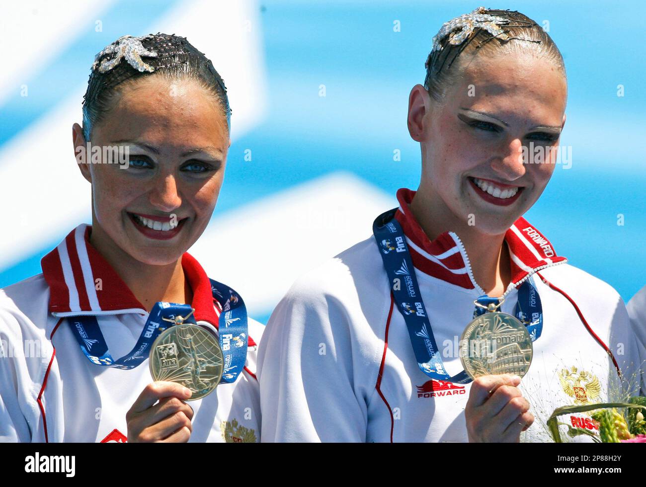 Russia's Anastasia Davydova and Svetlana Romashina show their gold ...