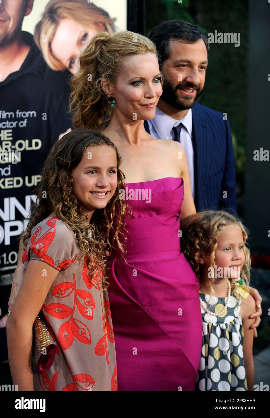 Judd Apatow, right, writer/director/producer of "Funny People," poses with his wife, cast member ...