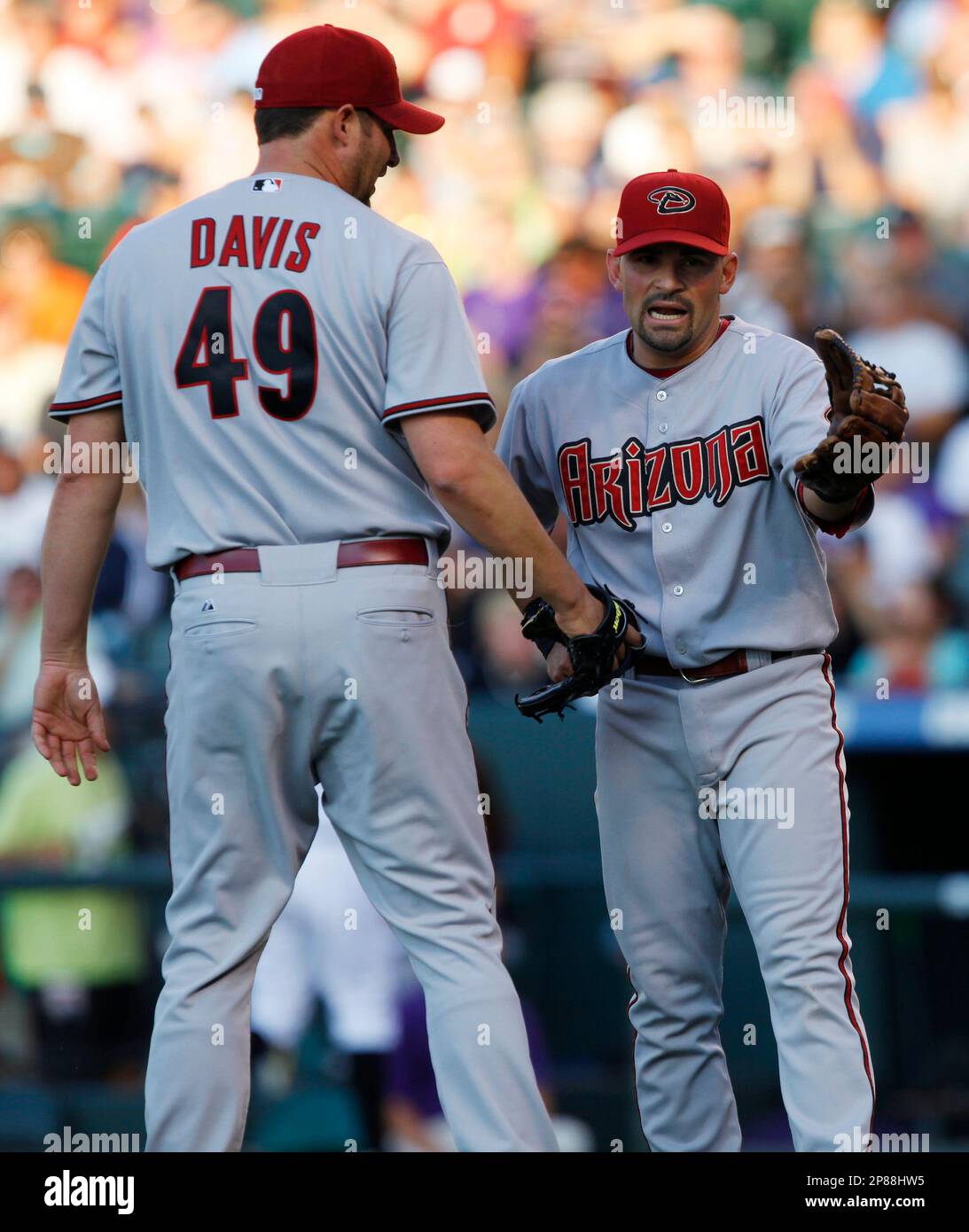 Arizona Diamondbacks starting pitcher Doug Davis, left, confers with ...