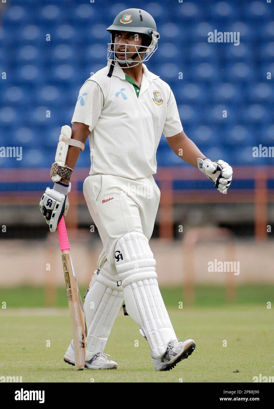 Bangladesh's opener Tamim Iqbal walks off the field after his dismissal ...