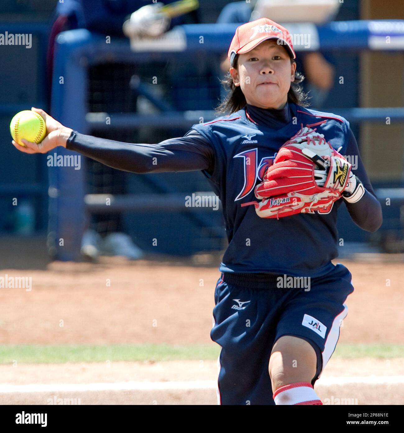 Japan third baseman Haruna Sakamoto throws to first base for an out ...