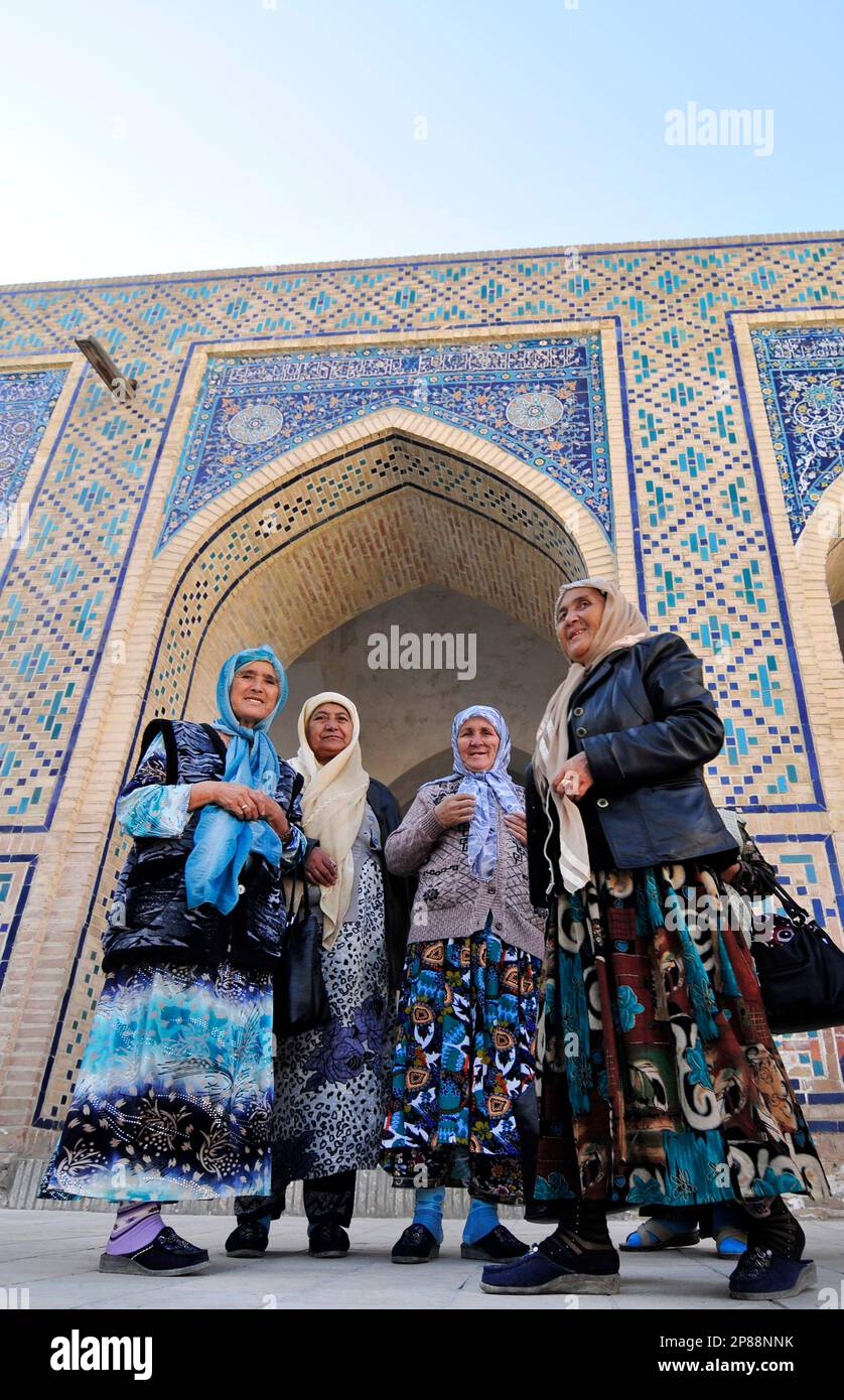 Uzbek women visiting the Kalan Mosque in the old city of Bukhara ...
